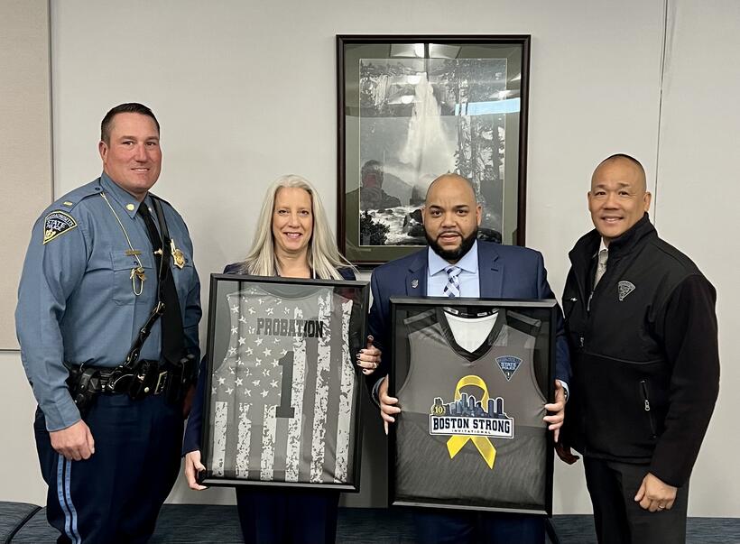 State Police and Roxbury ACPO Keison Harry present framed jerseys to ...